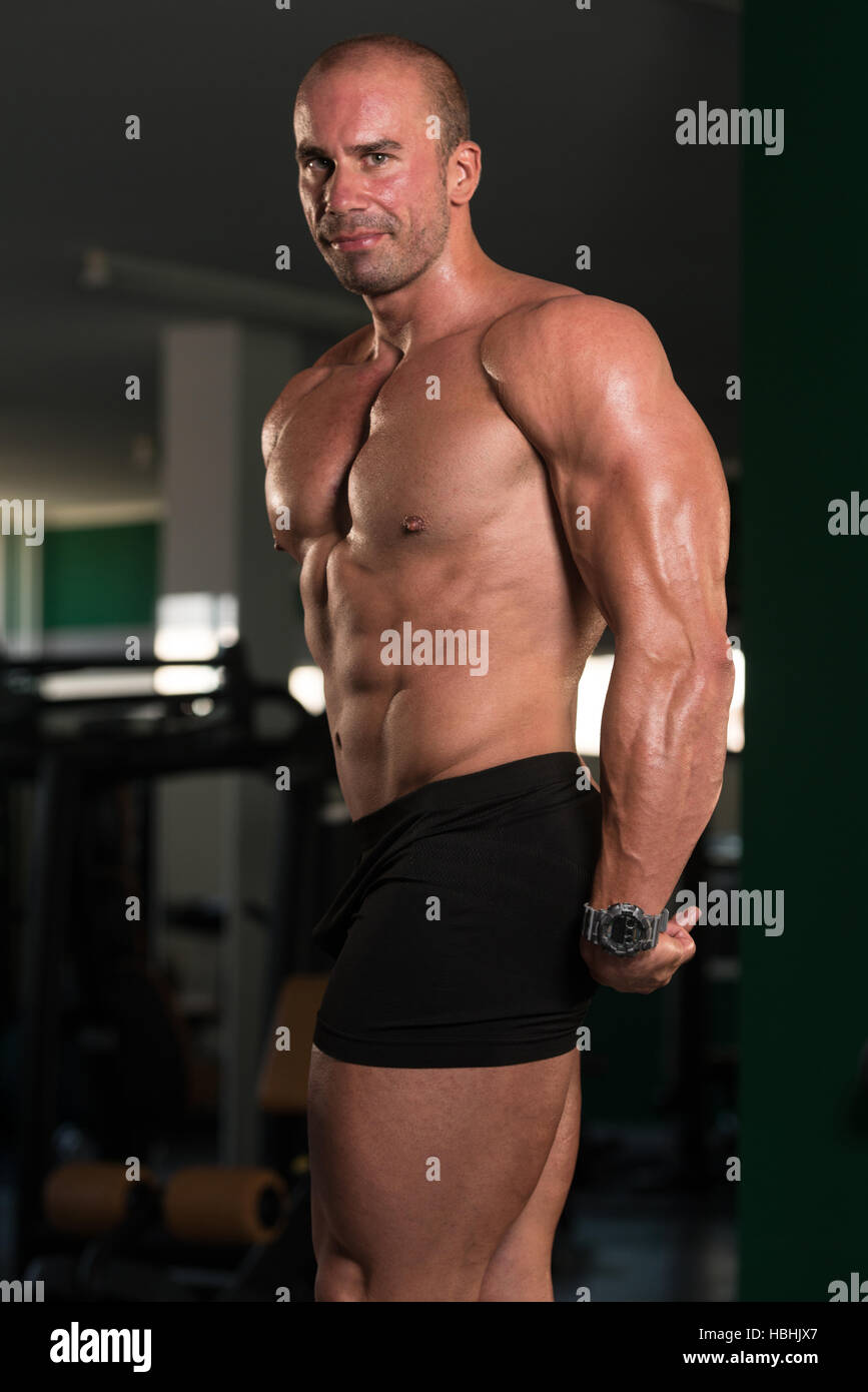 Bodybuilder Posing In Different Poses Demonstrating Their Muscles ...