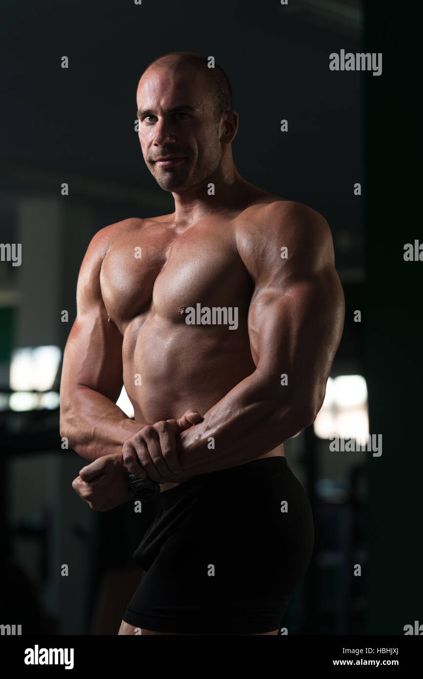 Bodybuilder Posing In Different Poses Demonstrating Their Muscles ...