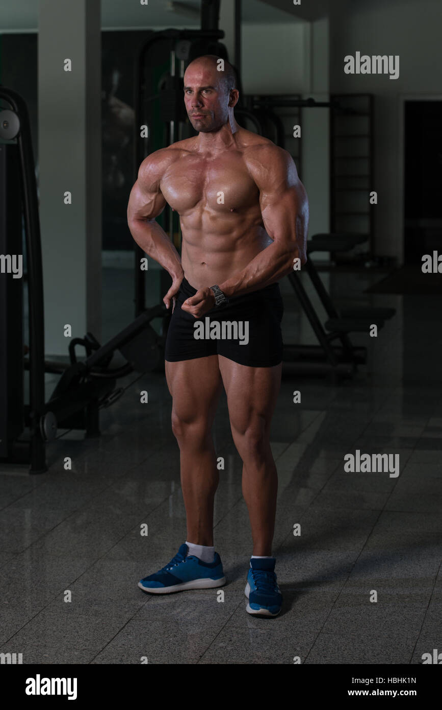 Bodybuilder Posing In Different Poses Demonstrating Their Muscles ...