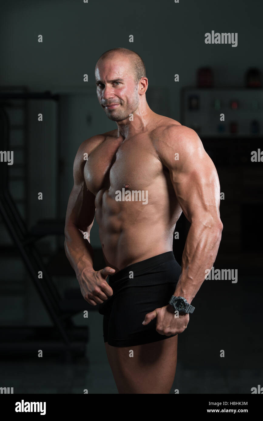 Bodybuilder Posing In Different Poses Demonstrating Their Muscles ...
