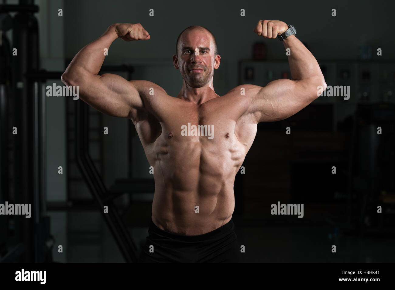 Bodybuilder Posing In Different Poses Demonstrating Their Muscles ...