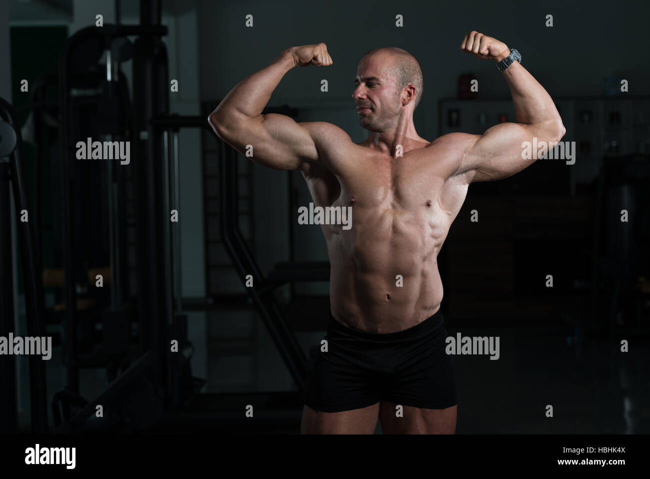 Bodybuilder Posing In Different Poses Demonstrating Their Muscles ...