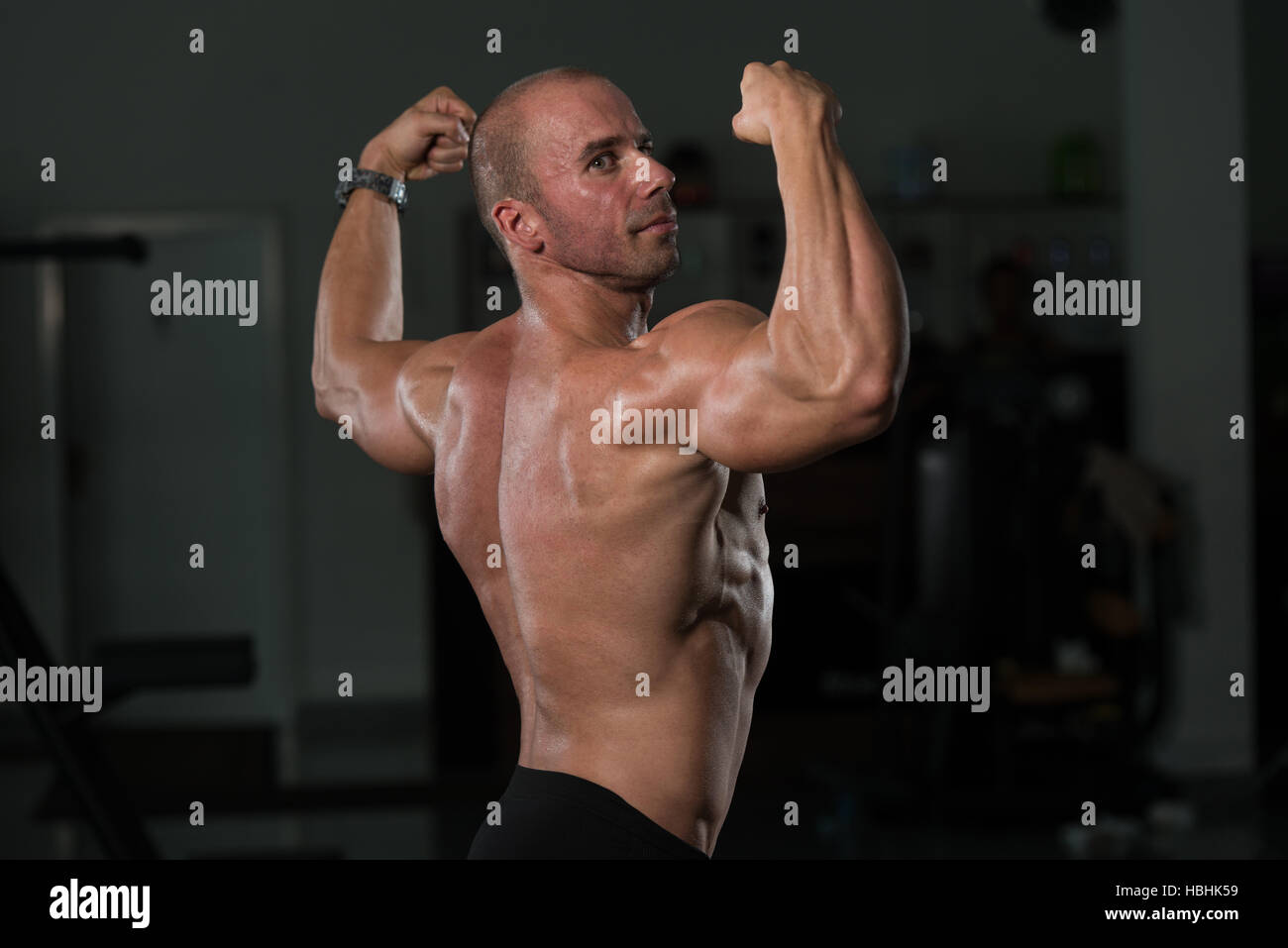 Bodybuilder Posing In Different Poses Demonstrating Their Muscles ...