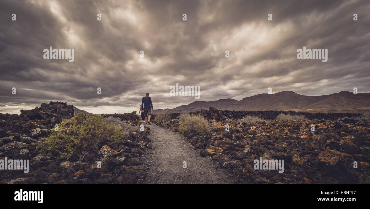 Man walking on a path Stock Photo - Alamy