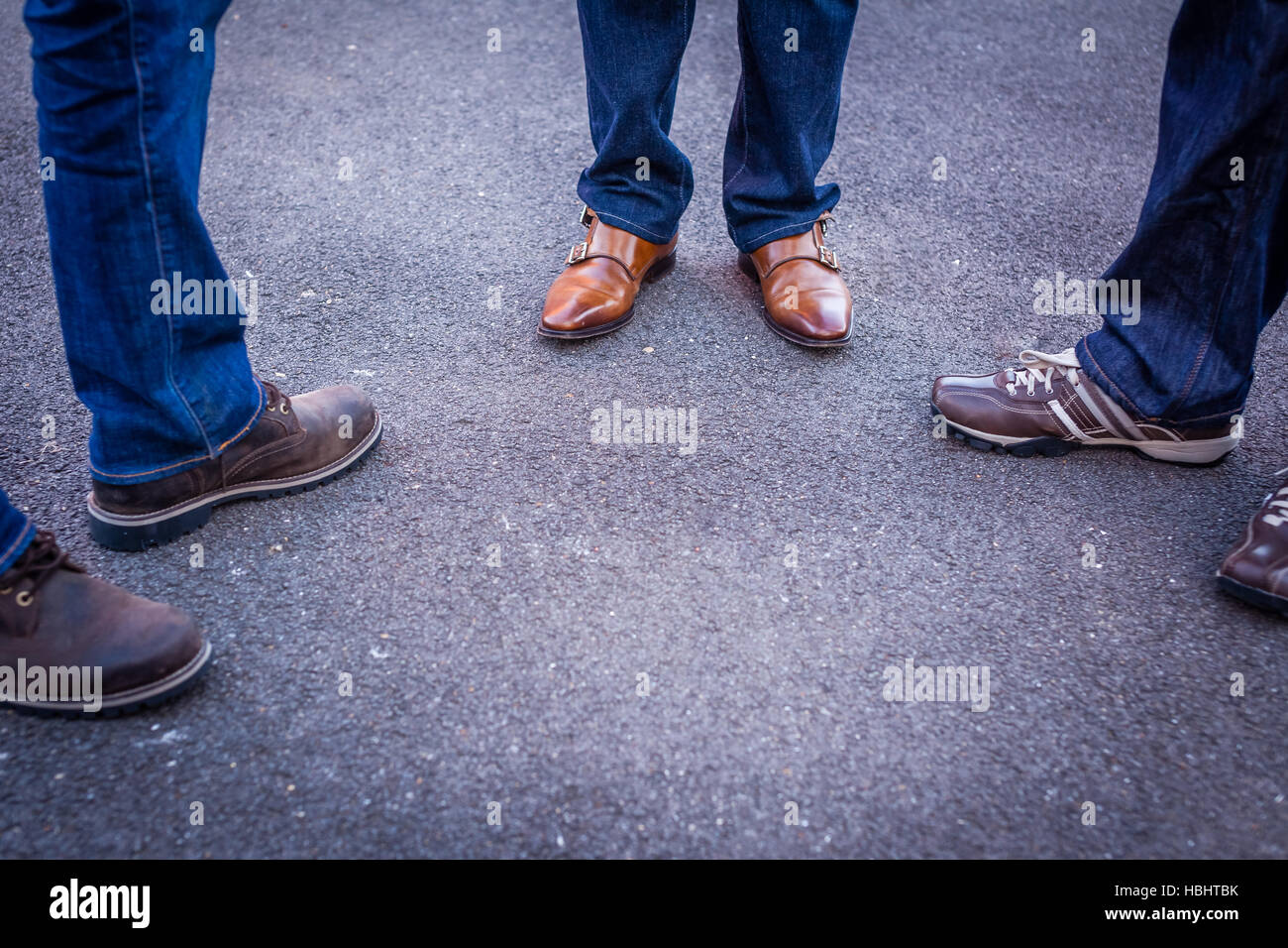 Three men standing Stock Photo - Alamy