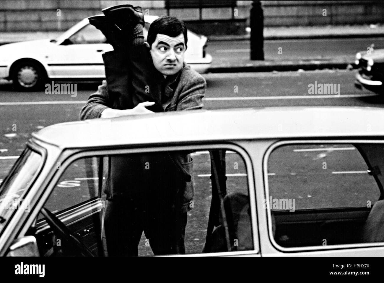 BEAN, Rowan Atkinson, getting into his green Mini car, 1997 Stock Photo ...