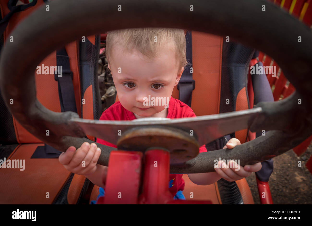 Little boy behind the wheel Stock Photo - Alamy