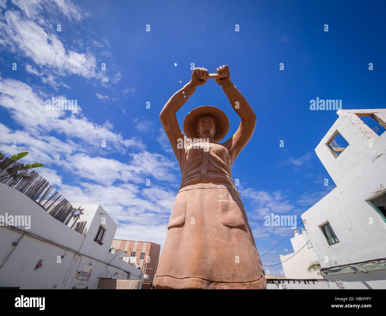 Sculpture of a woman holding a fish Stock Photo - Alamy