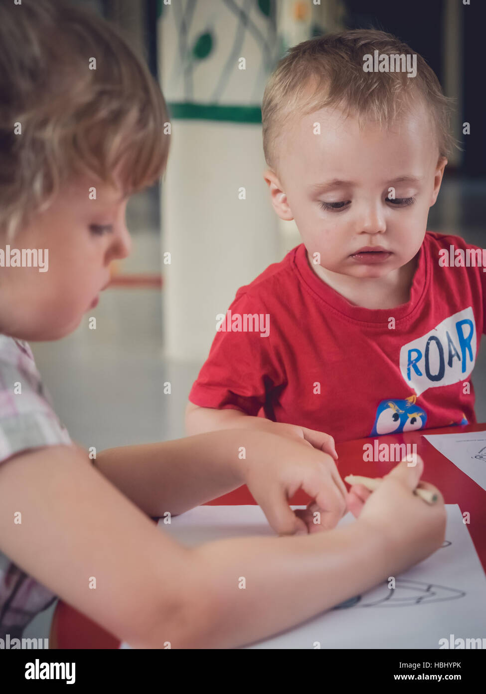 Little kids colouring Stock Photo - Alamy