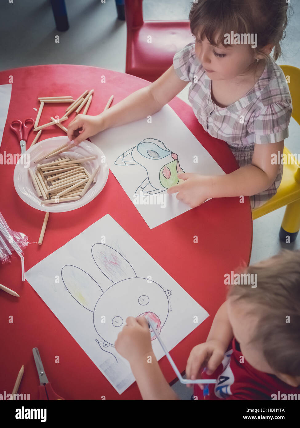 Little kids colouring Stock Photo - Alamy