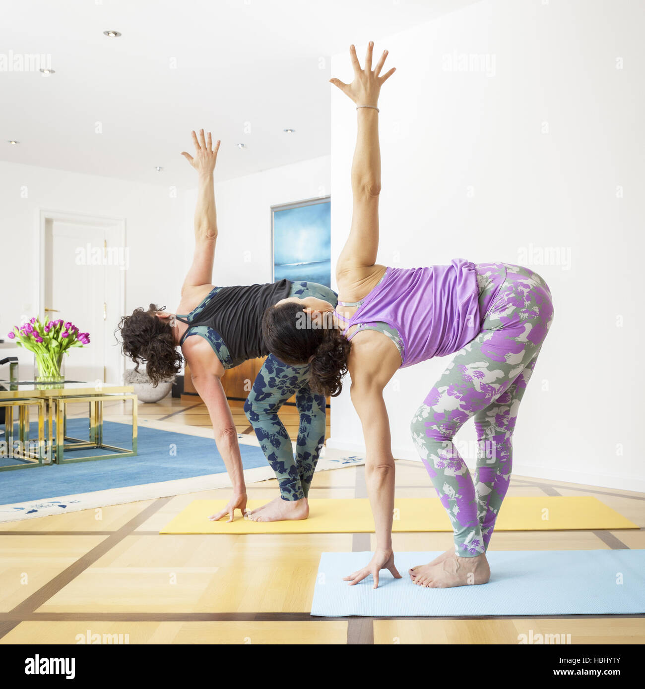 two women doing yoga at home Stock Photo - Alamy