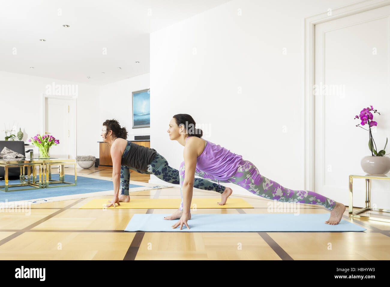 two women doing yoga at home Stock Photo - Alamy