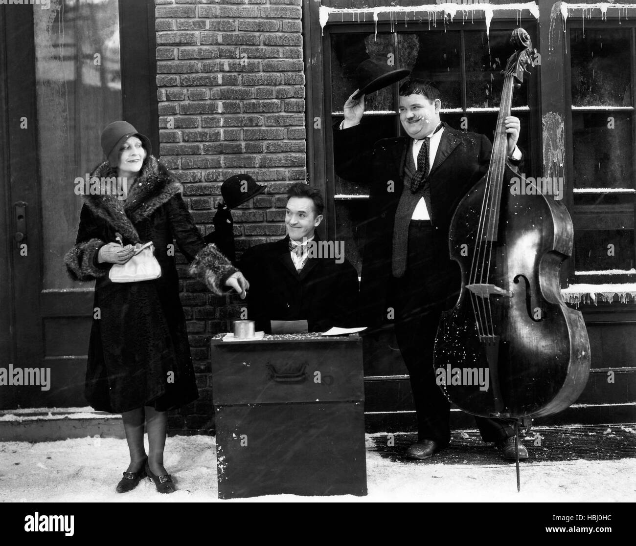 BELOW ZERO, Stan Laurel (center), Oliver Hardy, 1930 Stock Photo - Alamy