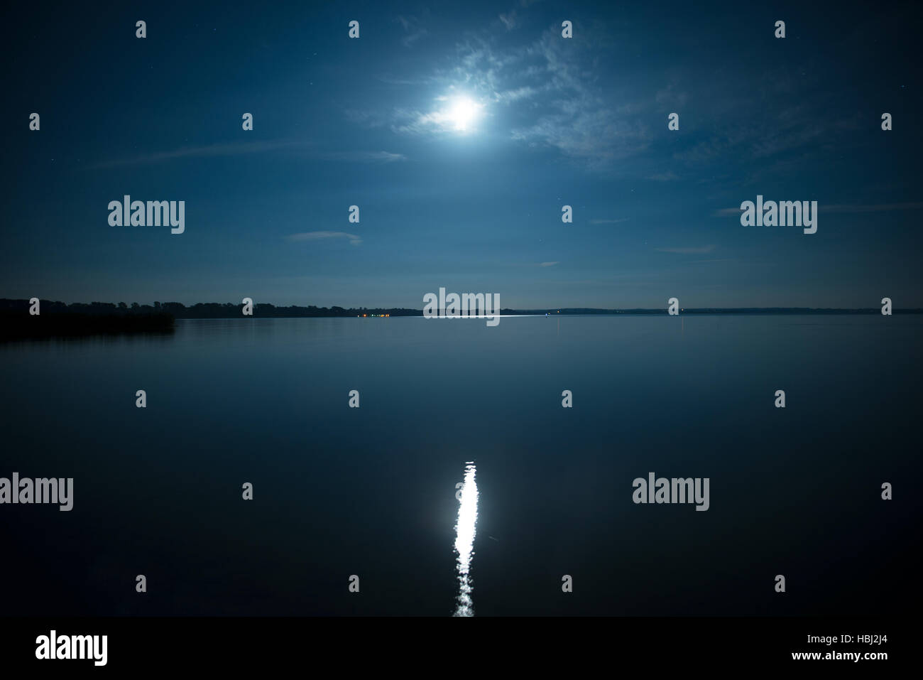 Full moon reflected in the water Stock Photo - Alamy