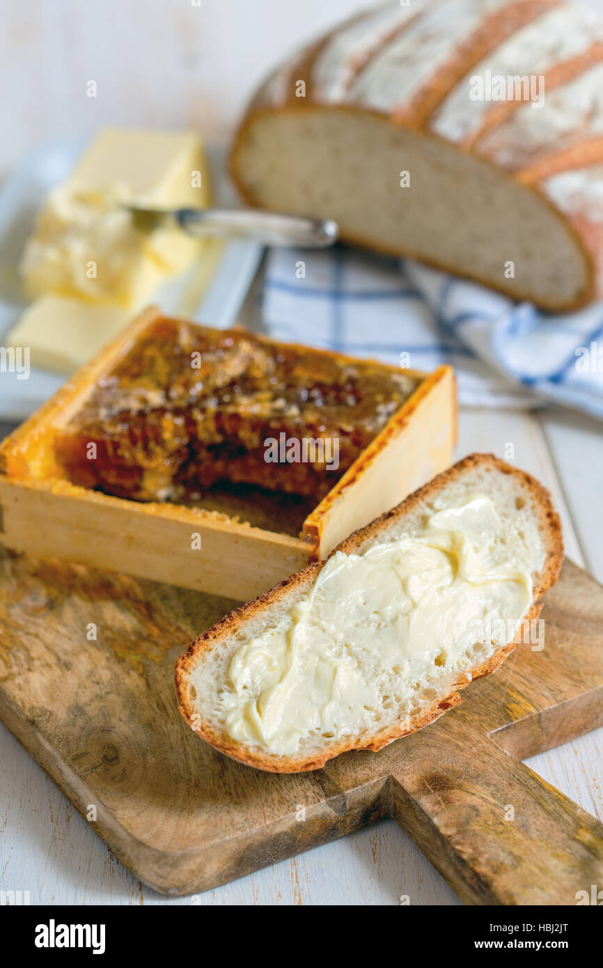 Butter on a piece of fresh homemade bread Stock Photo - Alamy