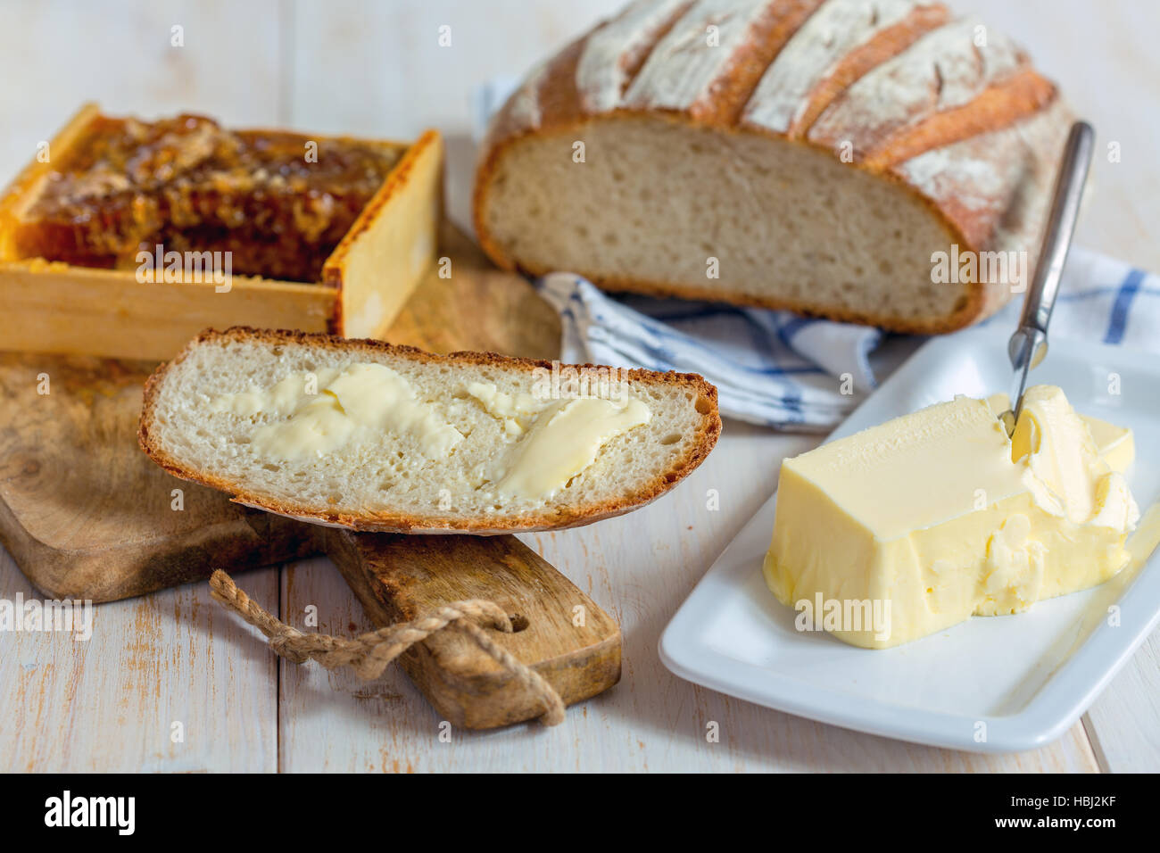 Piece of bread with butter close up Stock Photo - Alamy