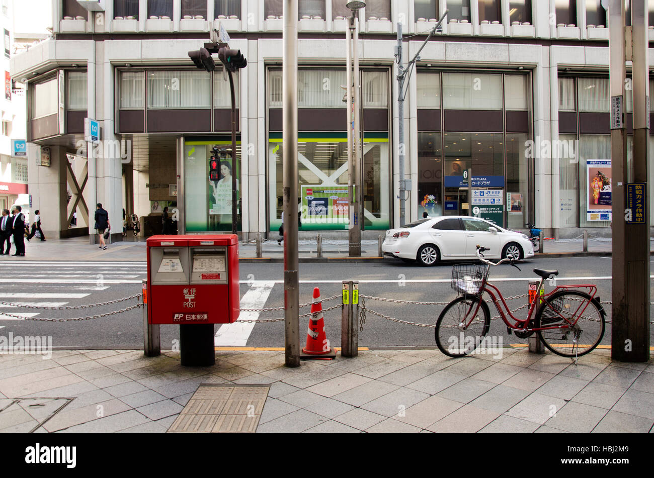 Public post box on pathway beside traffic road for people use at ...