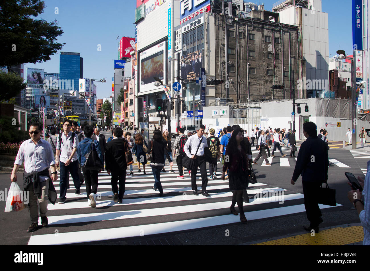 Japanese people walking crosswalk traffic road at shinjuku city on ...