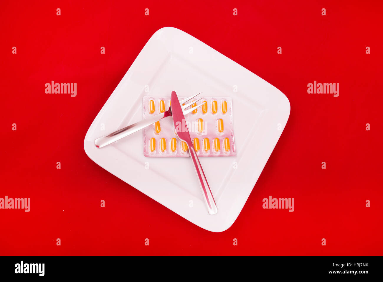 Plate with medicine Stock Photo - Alamy