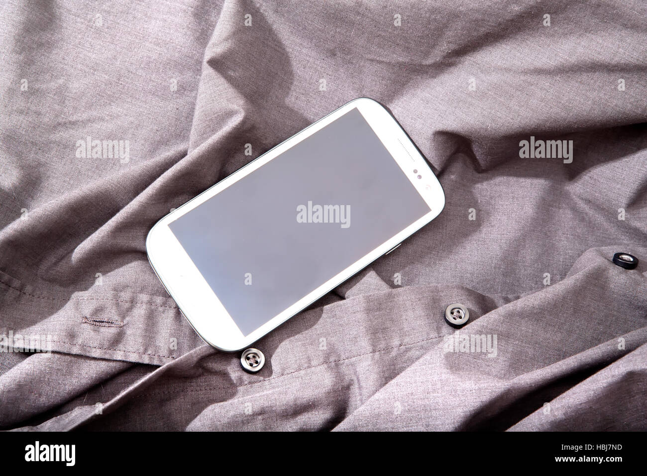 Smartphone on a shirt Stock Photo - Alamy