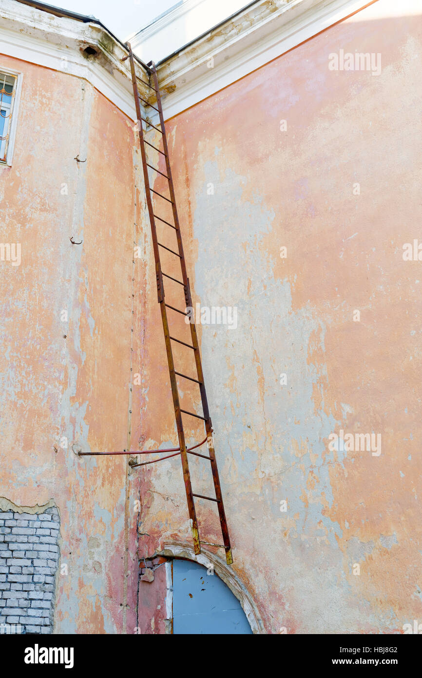 Old fire escape on a wall background Stock Photo - Alamy