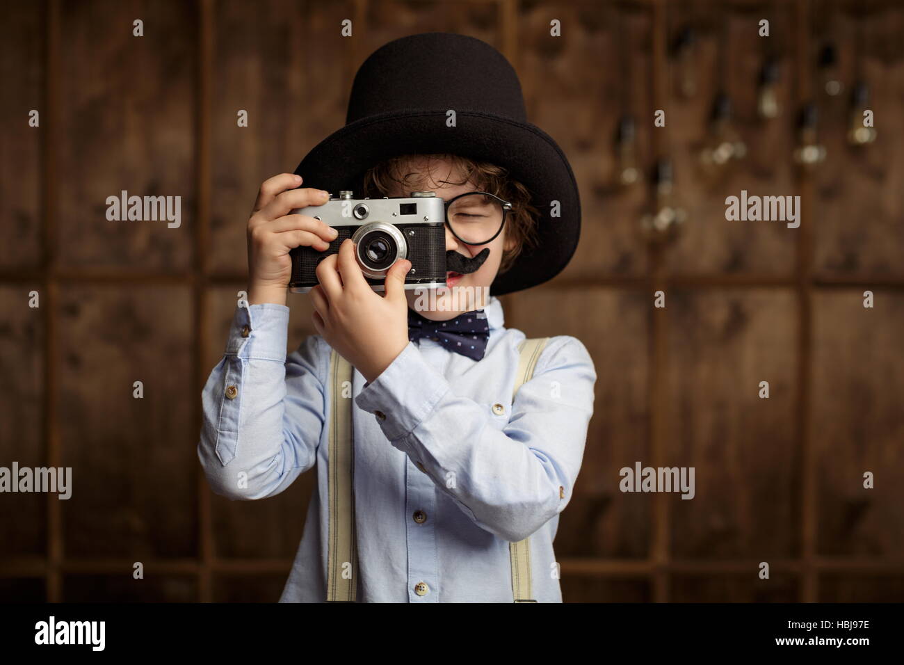 Boy with camera Stock Photo - Alamy