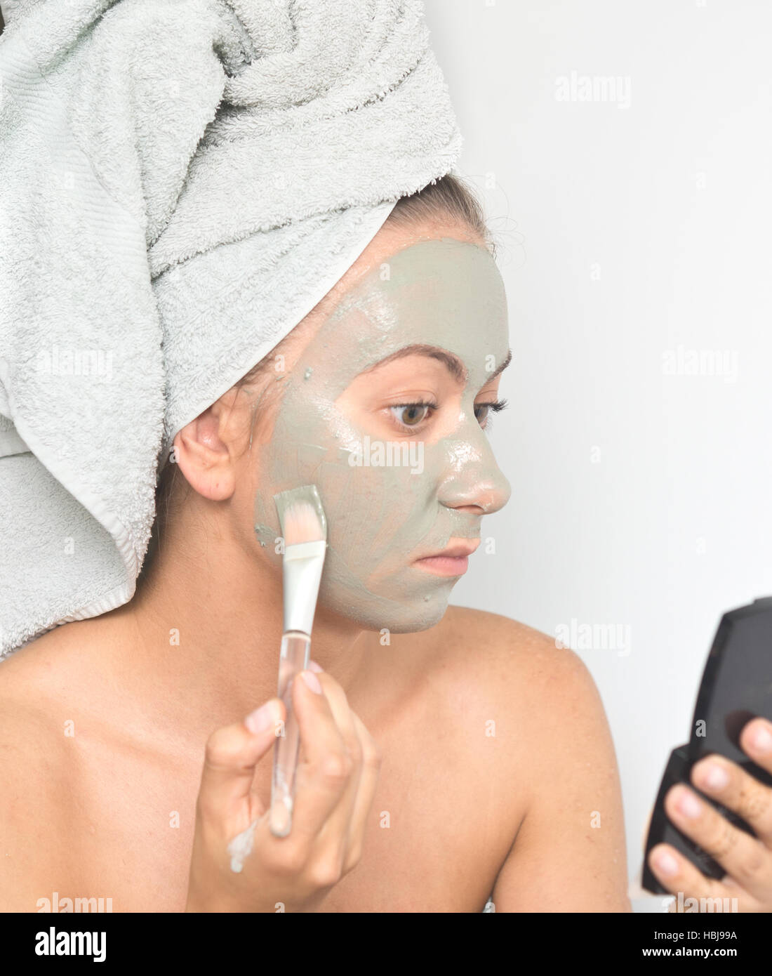 woman applying mask Stock Photo - Alamy