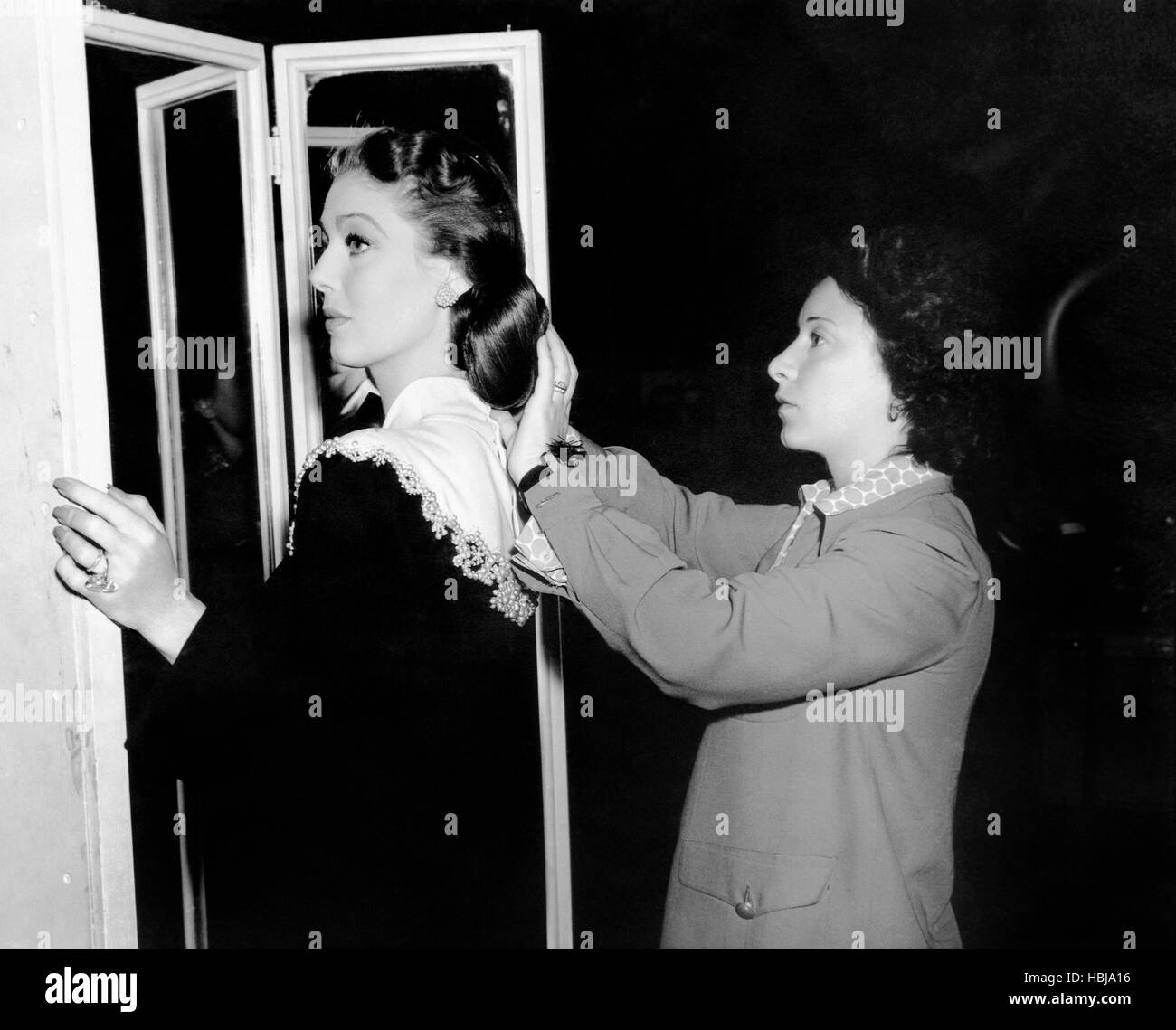 BEDTIME STORY, Loretta Young, left, being touched up on-set by ...