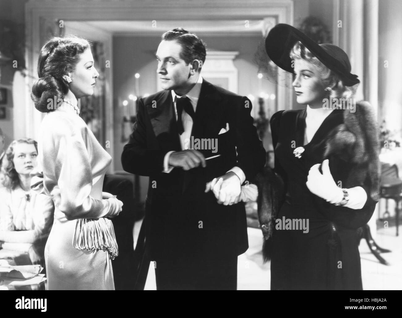 BEDTIME STORY, standing from left: Loretta Young, Fredric March, Jayne ...