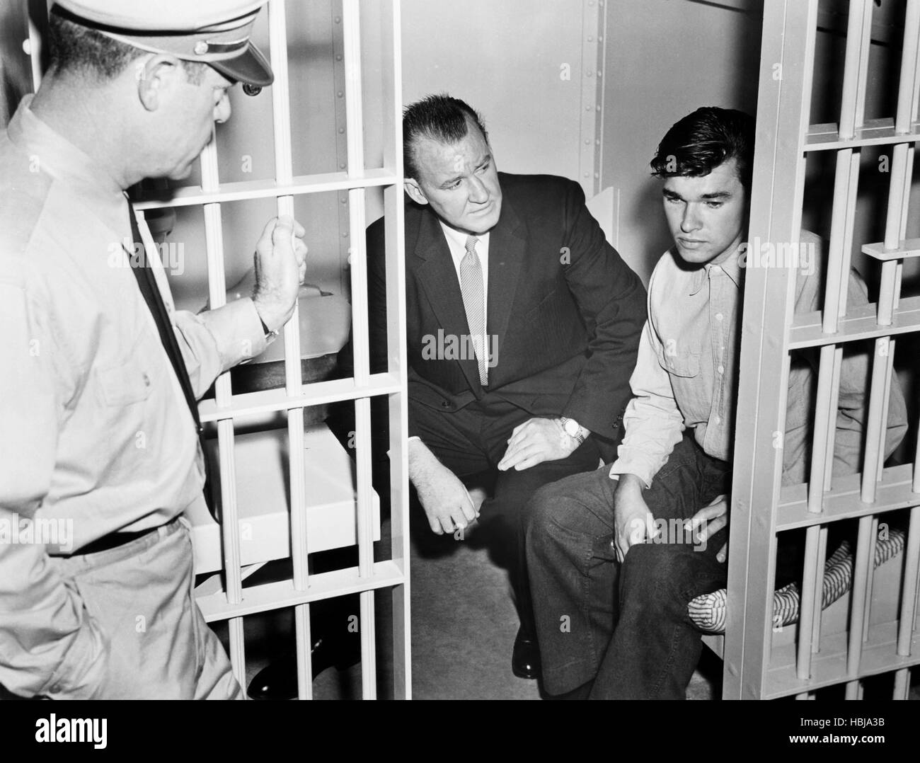BEHIND THE HIGH WALL, from left, John Larch, John Gavin, 1956 Stock ...