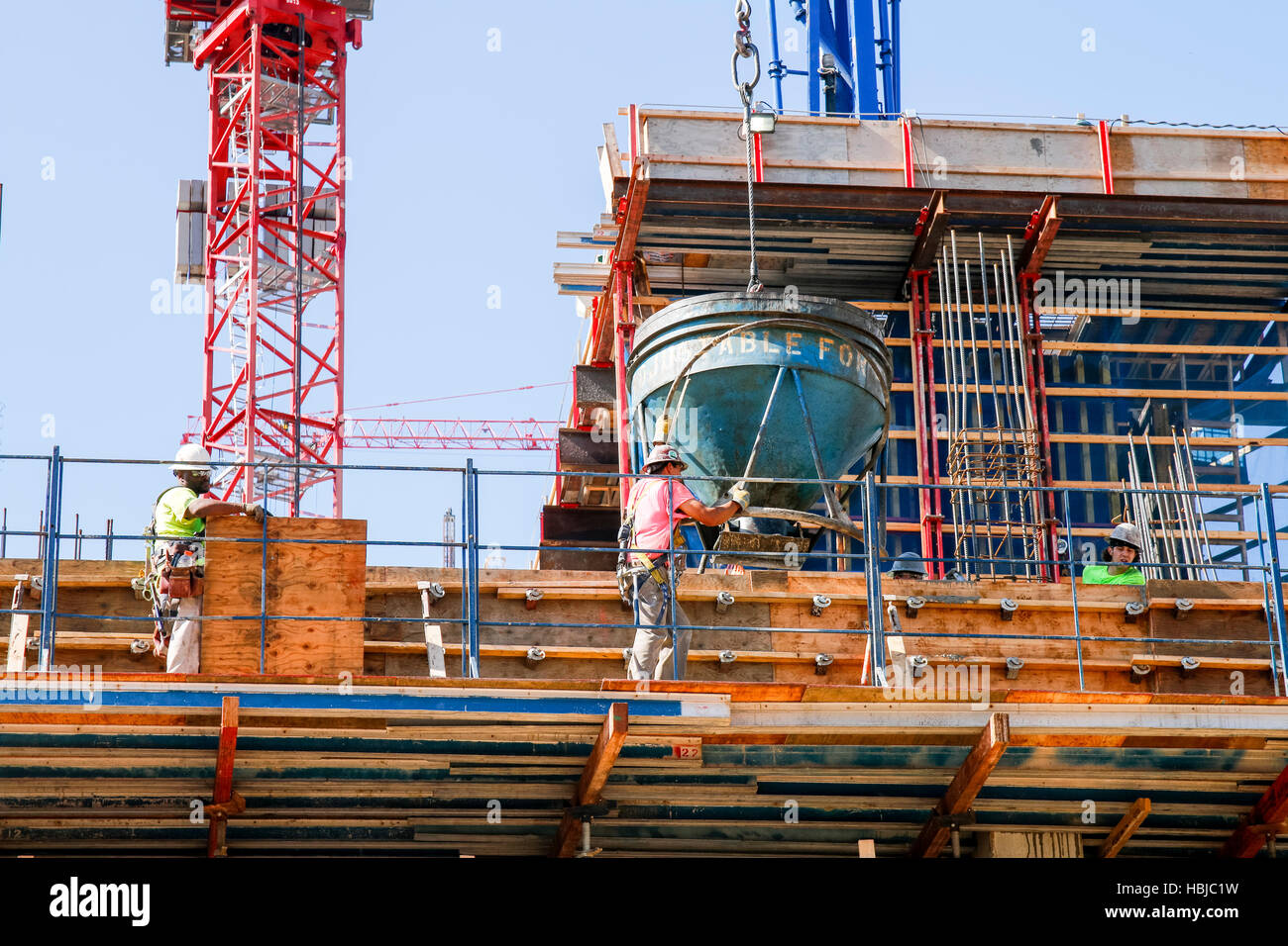Construction workers pouring concrete. Chicago, Illinois Stock Photo ...