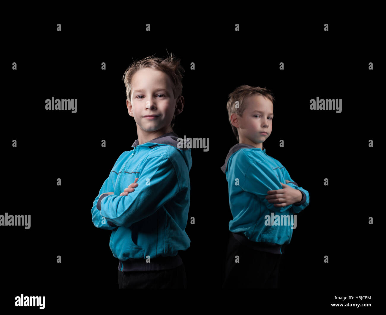Studio shot of serious little twin brothers Stock Photo - Alamy