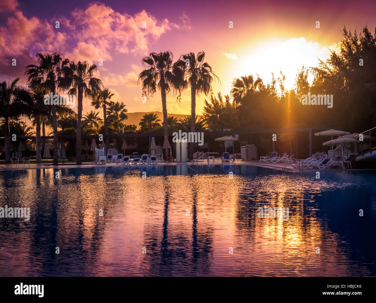 Large swimming pool at dusk Stock Photo - Alamy