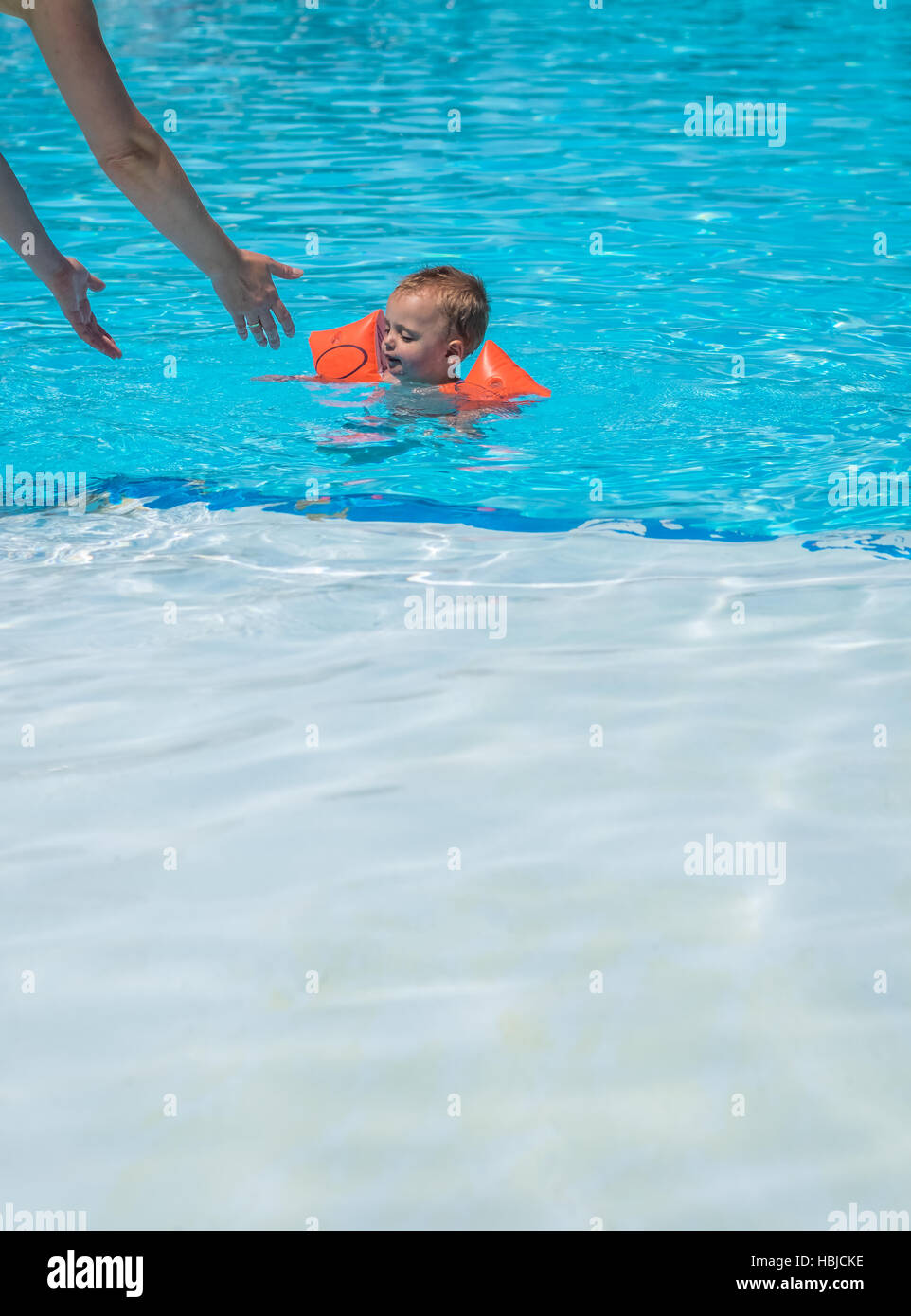 Boy in the pool Stock Photo - Alamy