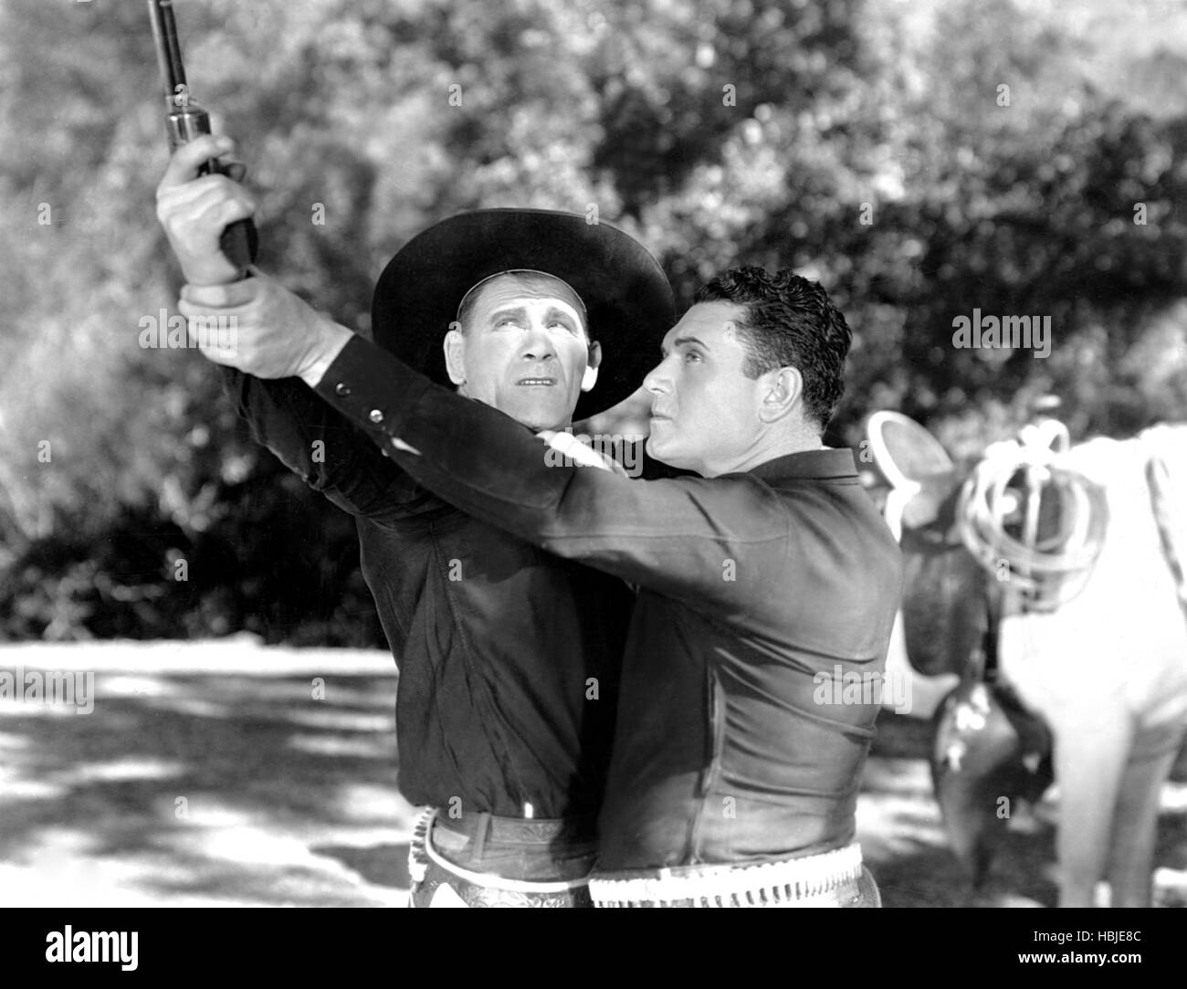 BLAZING GUNS, from left: Frank McCarroll, Reb Russell, 1935 Stock Photo ...