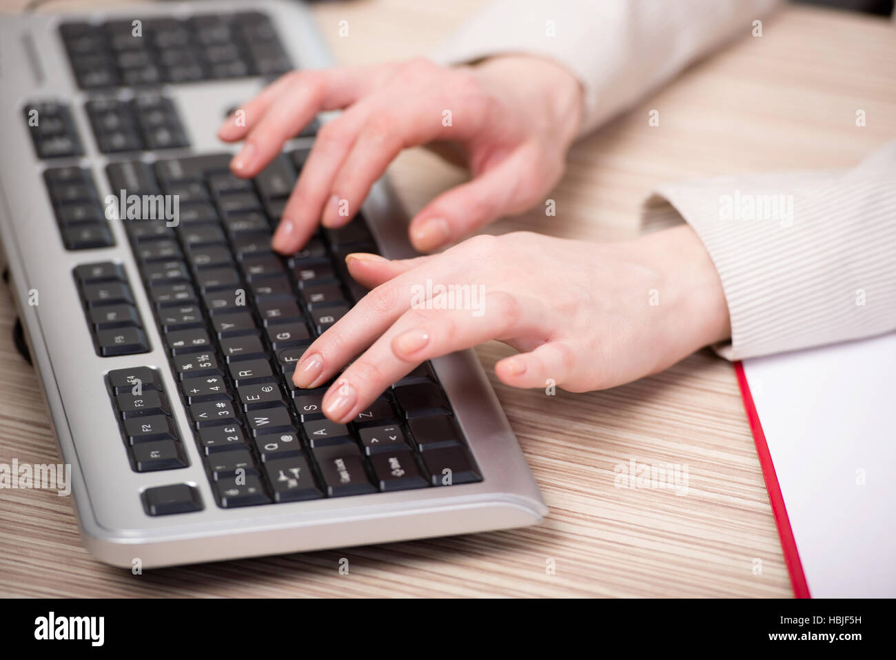 Hands working on the keyboard in the office Stock Photo - Alamy
