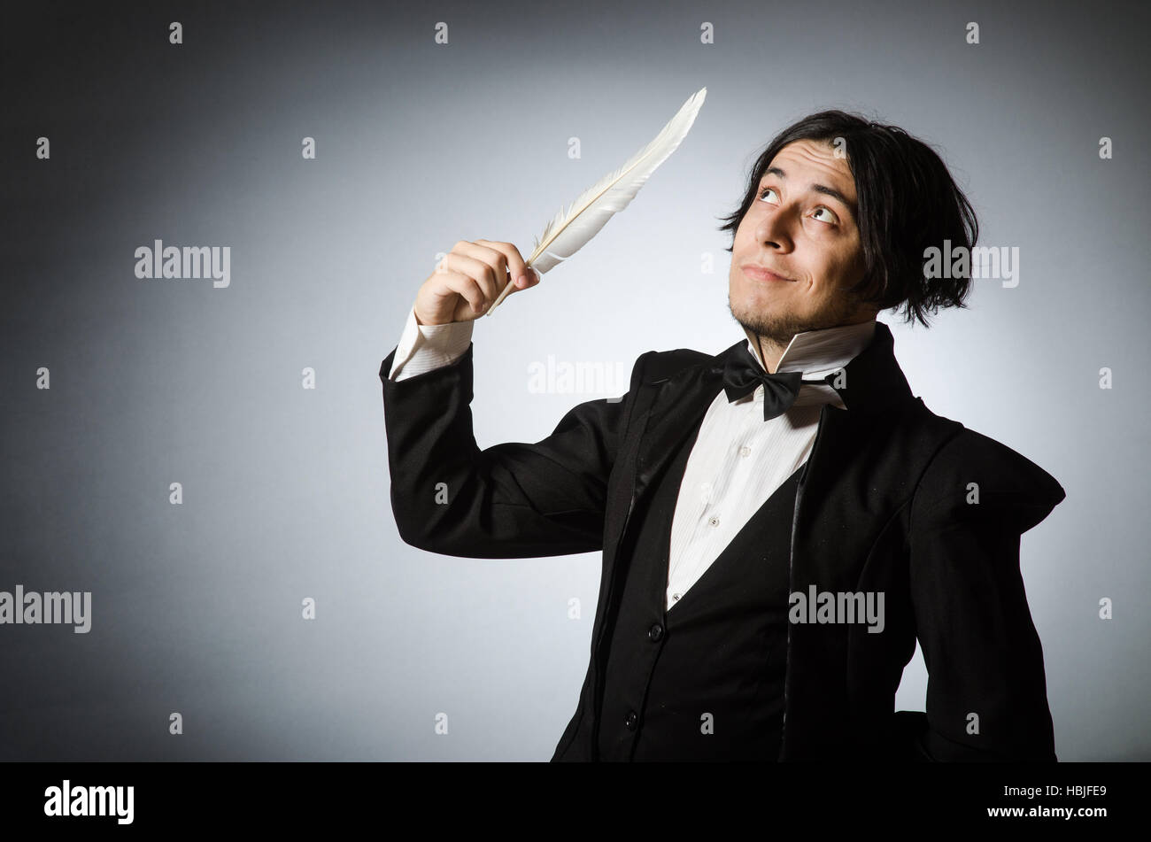 Funny writer with quill in vintage concept Stock Photo - Alamy