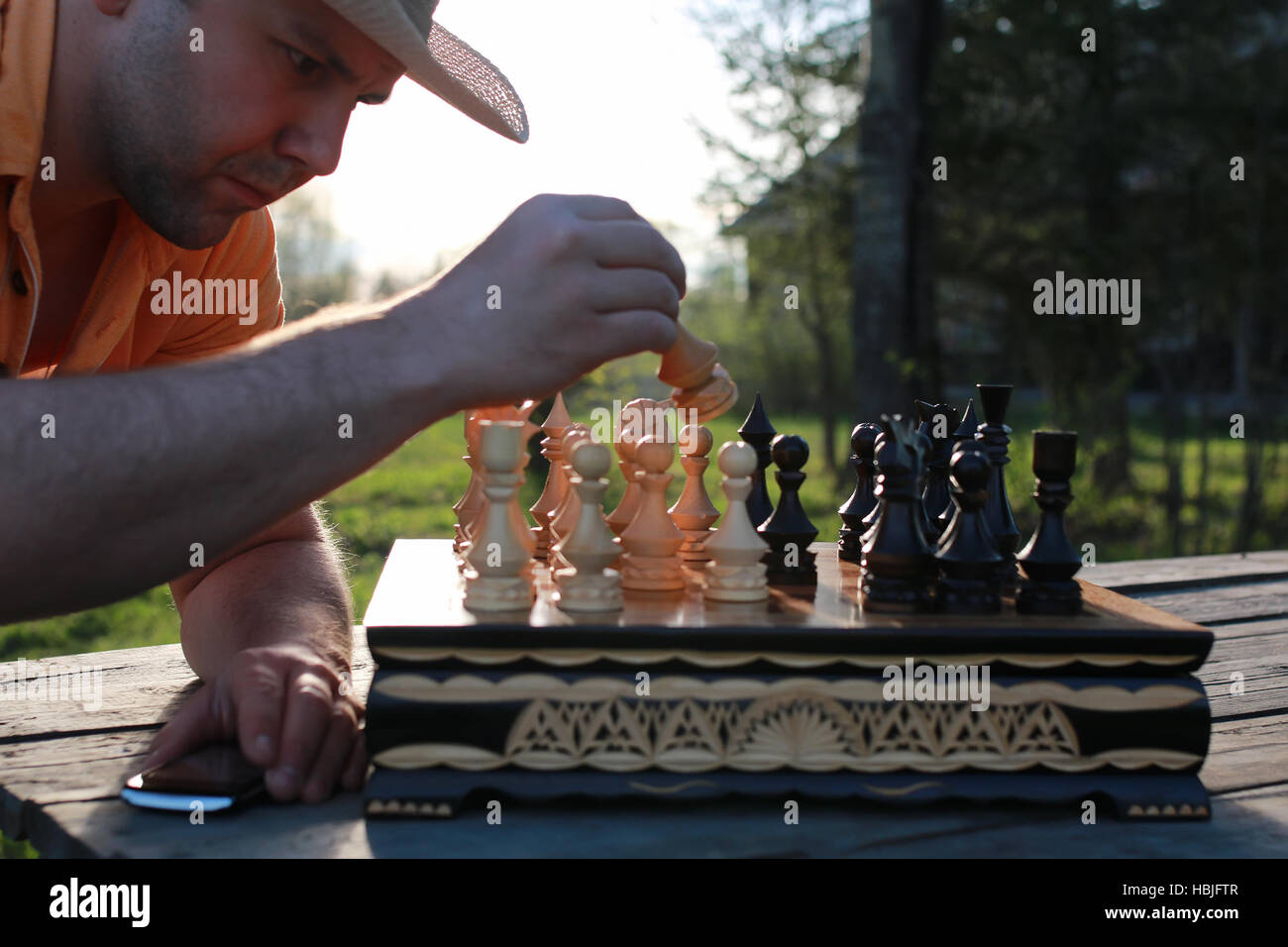 chess man hand outdoor Stock Photo - Alamy