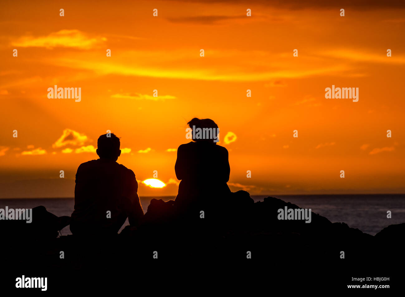 Sun Setting on the Ocean Stock Photo - Alamy