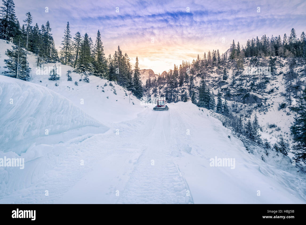 Alpine road mapped out in snow, Austria Stock Photo - Alamy