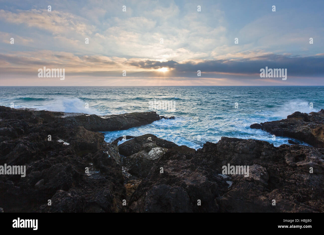 Evening seascape view from rocky shore Stock Photo - Alamy