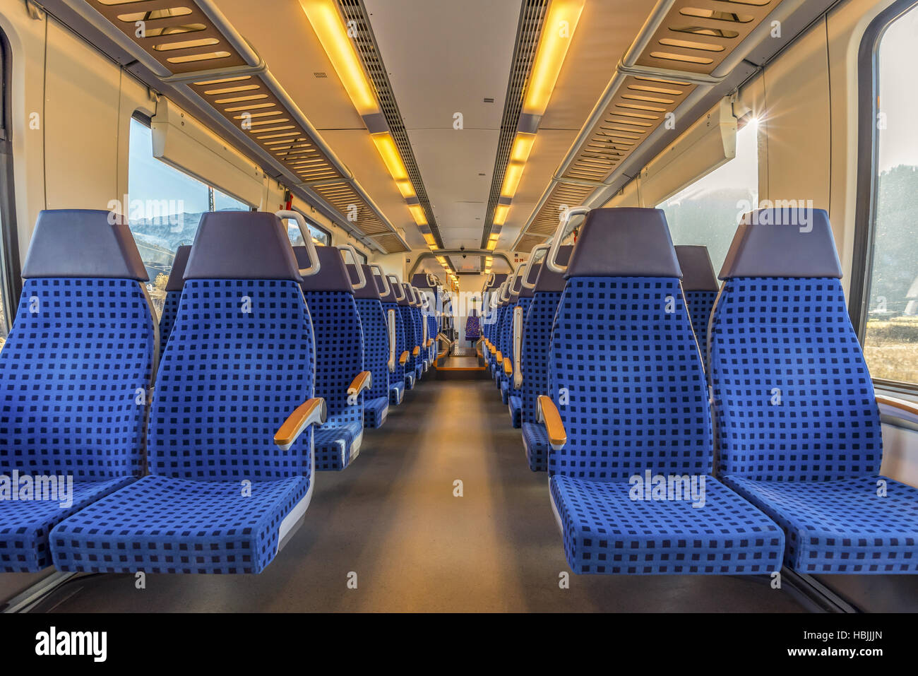 Modern train chairs disposed on two rows Stock Photo - Alamy