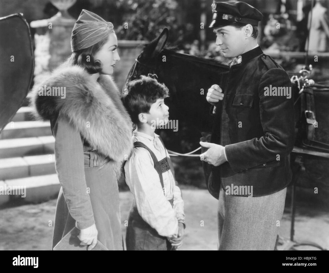 THE BRIDE WORE RED, from left: Joan Crawford, Dickie Moore, Franchot ...