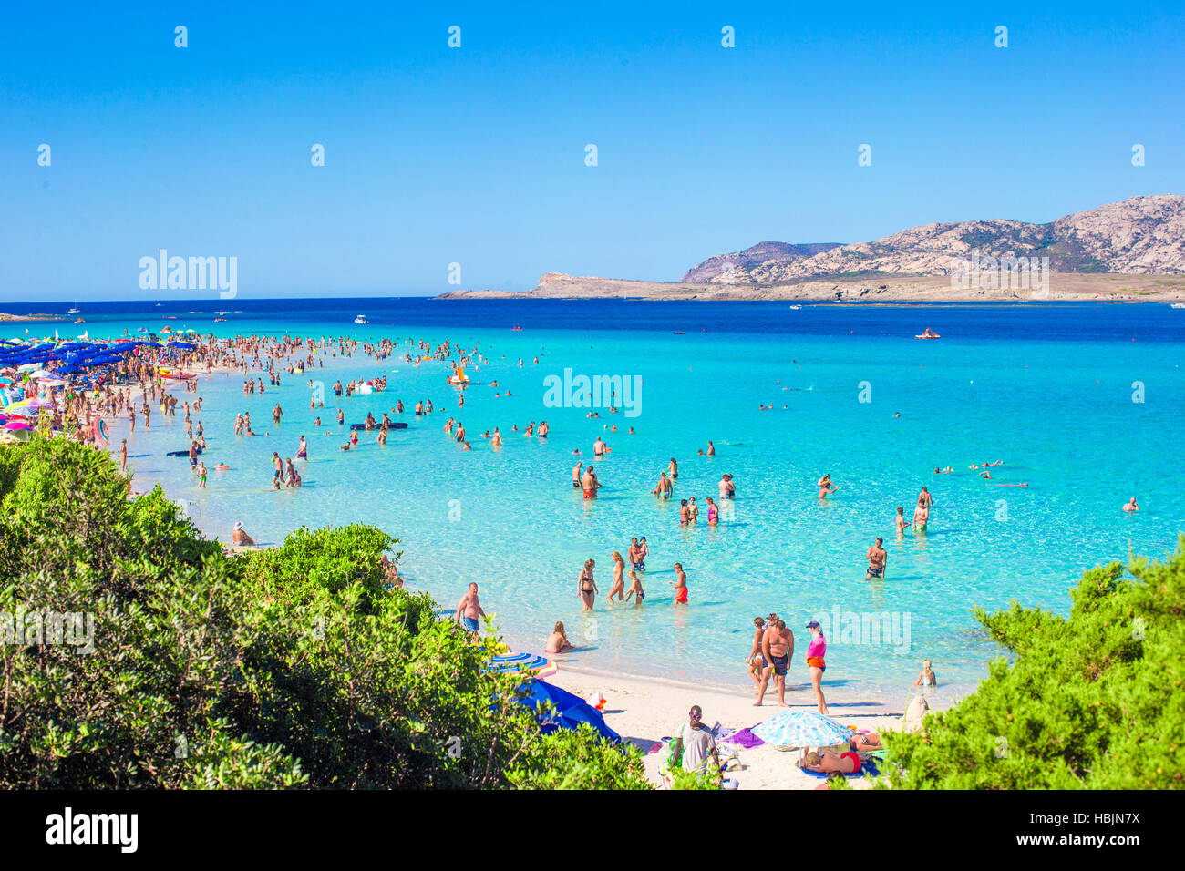 View to the city beach with lots of people sunbathing and swimming ...