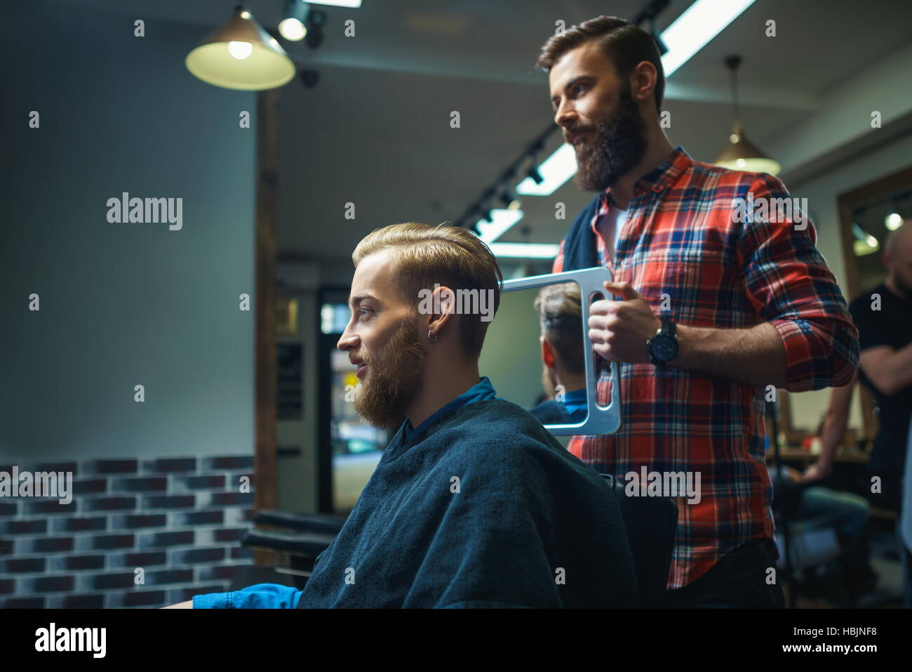 Barber in mirror hi-res stock photography and images - Alamy