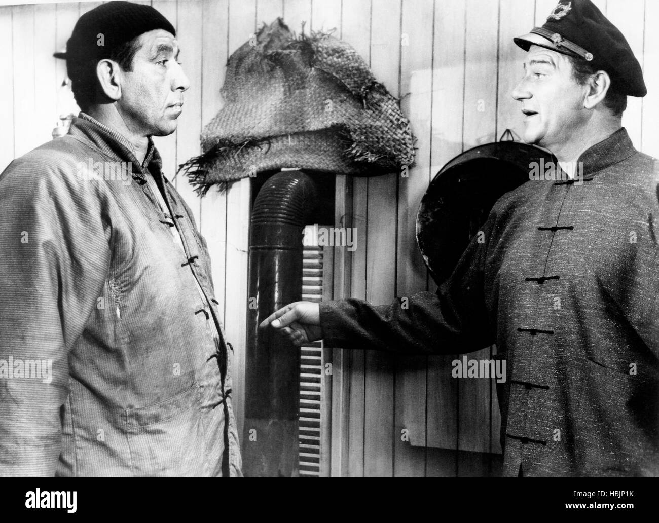 BLOOD ALLEY, from left: Mike Mazurki, John Wayne, 1955 Stock Photo - Alamy