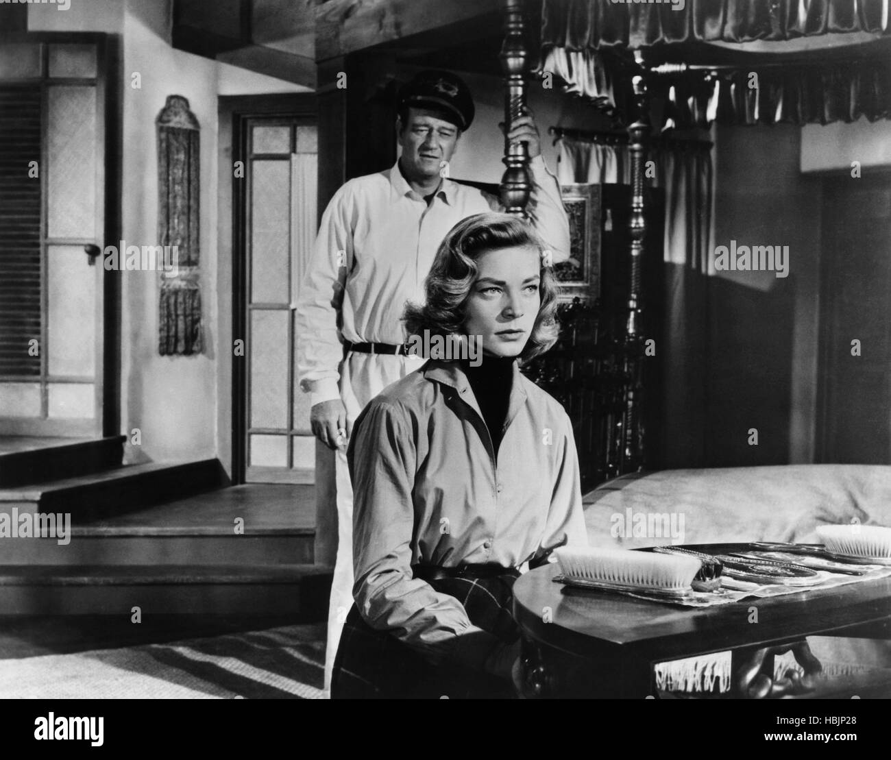 BLOOD ALLEY, Lauren Bacall (front), John Wayne, 1955 Stock Photo - Alamy