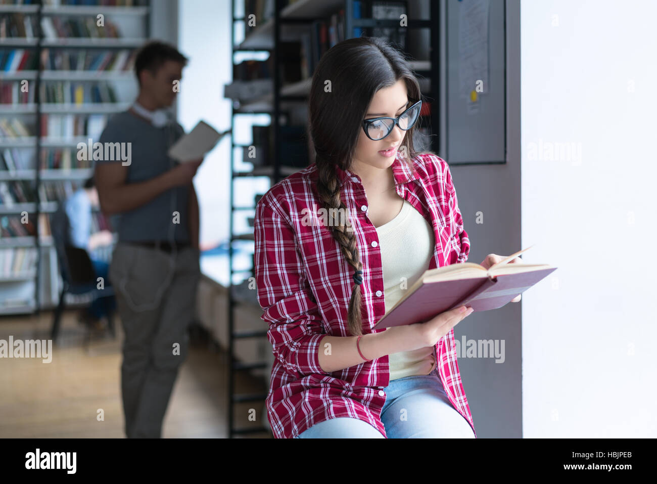 Girl with book Stock Photo - Alamy