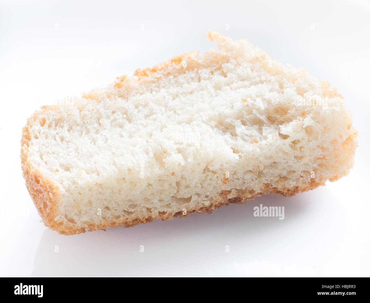 Simple piece of bread on white isolated background Stock Photo - Alamy