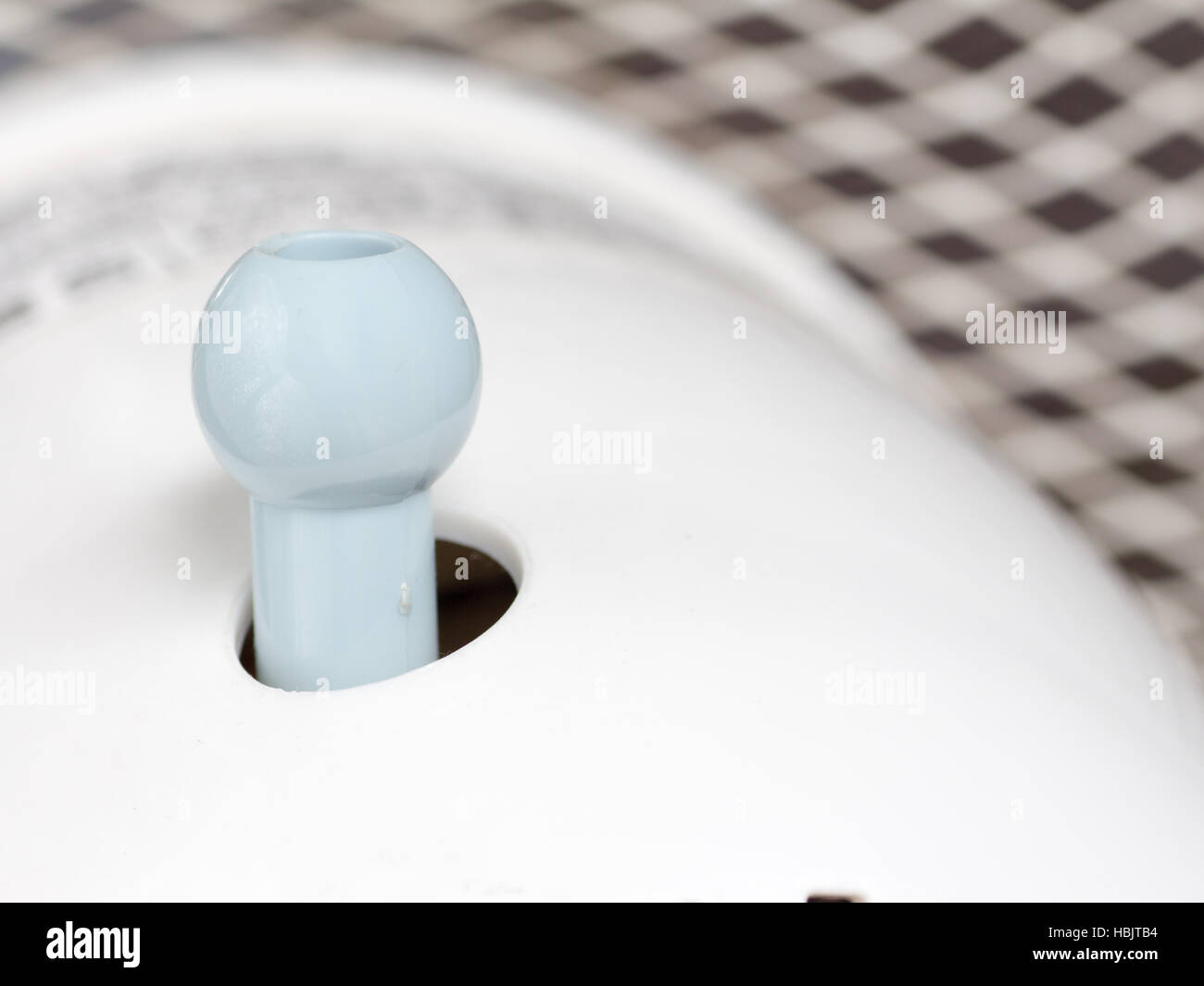 A blue knob switch of Japanese electric fan to activate the oscillating ...